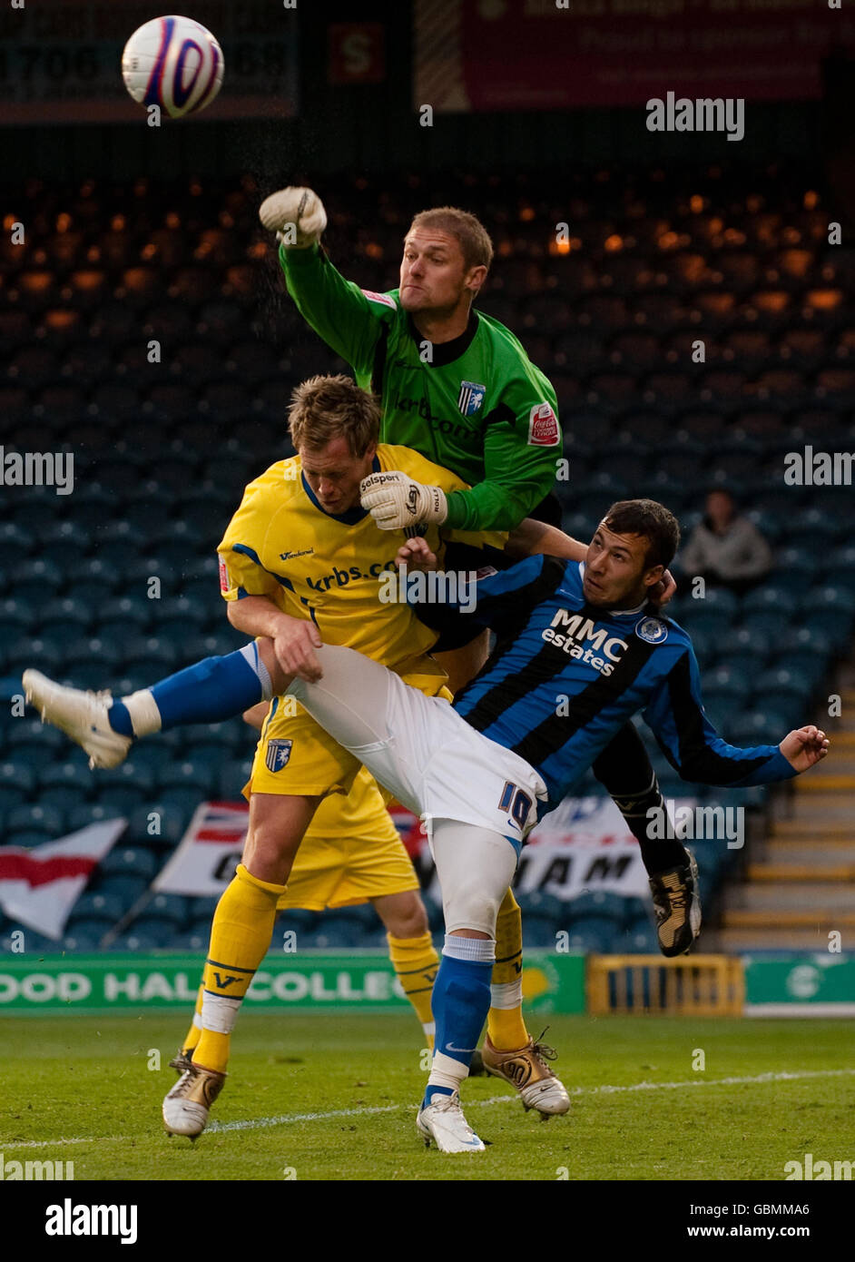 Gillingham goalkeeper Simon Royce punches clear of Rochdale's Adam ...