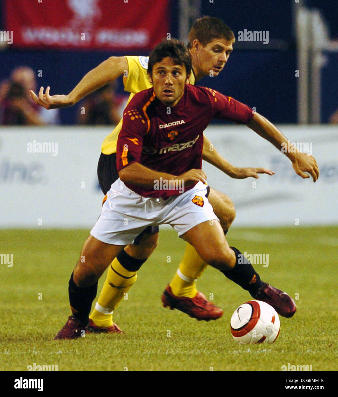 AS Roma's Vincenzo Montella (front) gets away from Liverpool's Steven ...