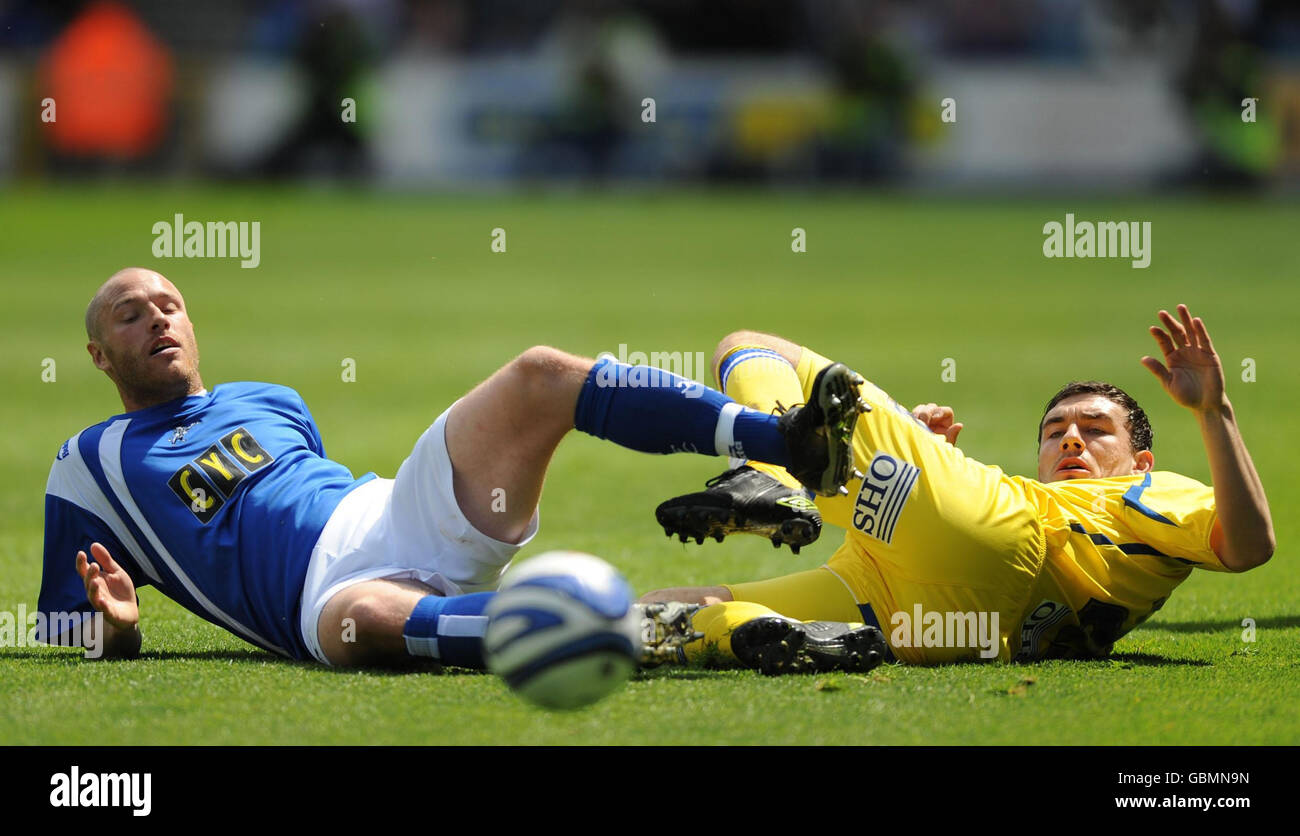 Millwall's Gary Alexander and Leeds' Robert Snodgrass battle for the ...