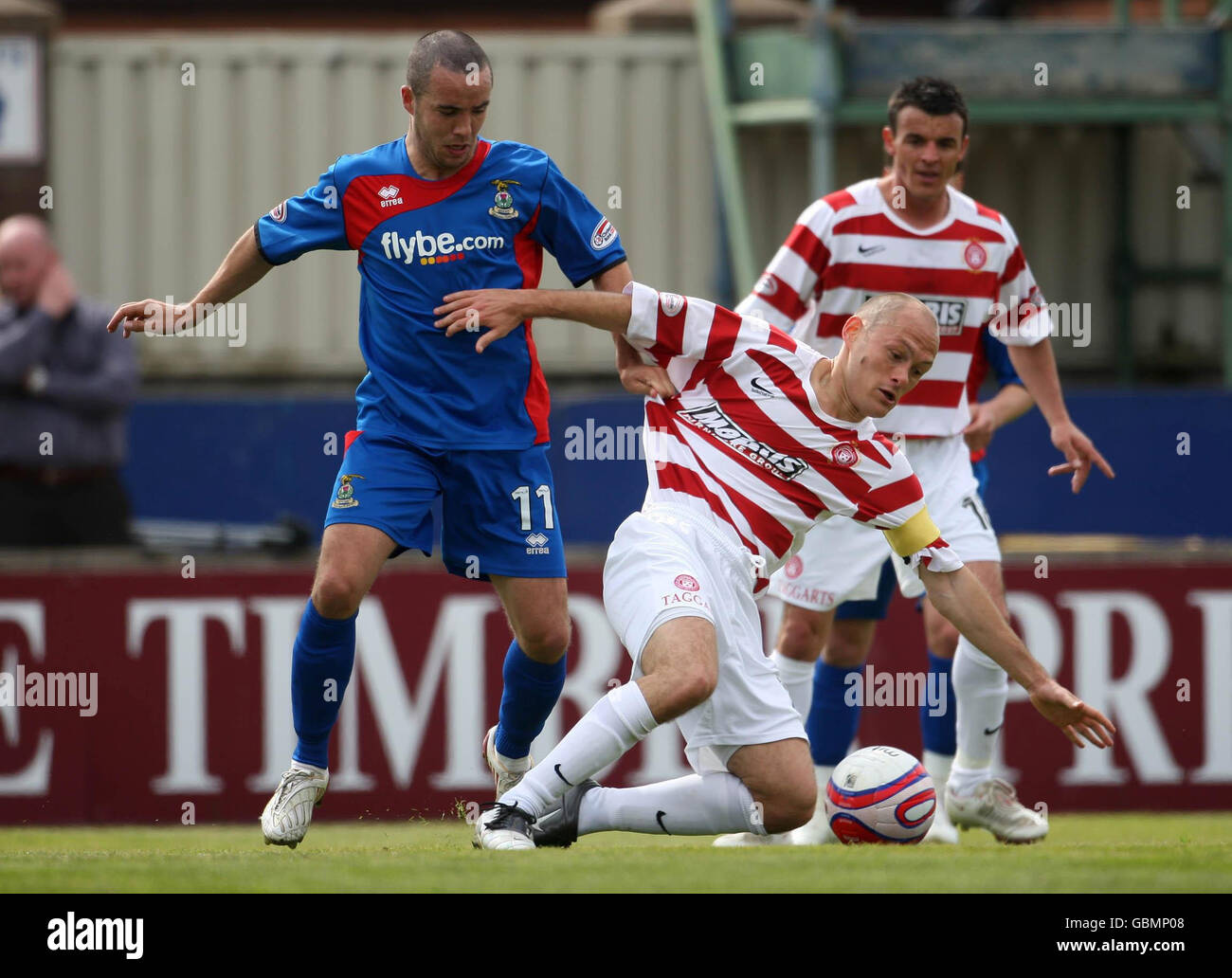 Inverness' Dougie Imrie Hamiton's and Alec Burke battle for the ball ...