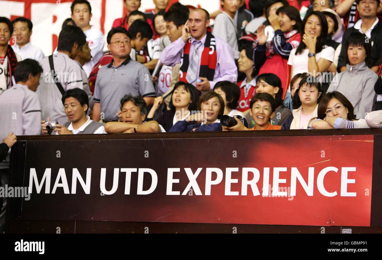 Urawa Red Diamonds fans stand dejected inside Manchester United's Old ...