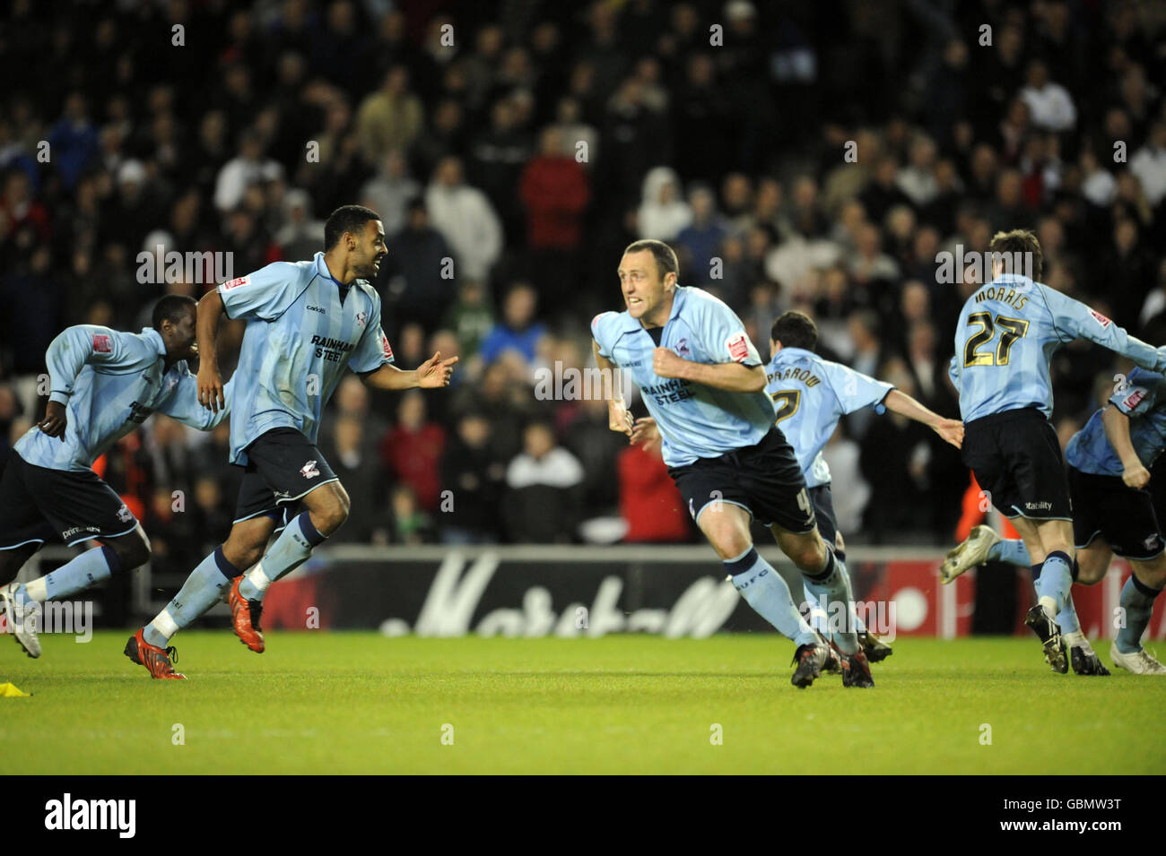 Scunthorpe United players celebrate after the final penalty during the ...