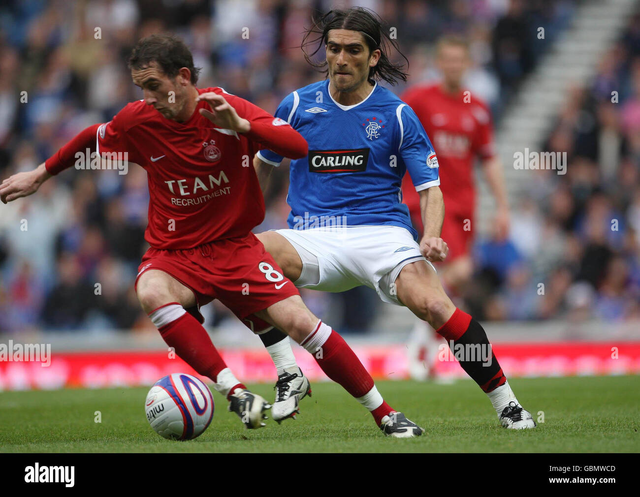 Rangers' Pedro Mendes (right) and Aberdeen's Stuart Kerr in action ...