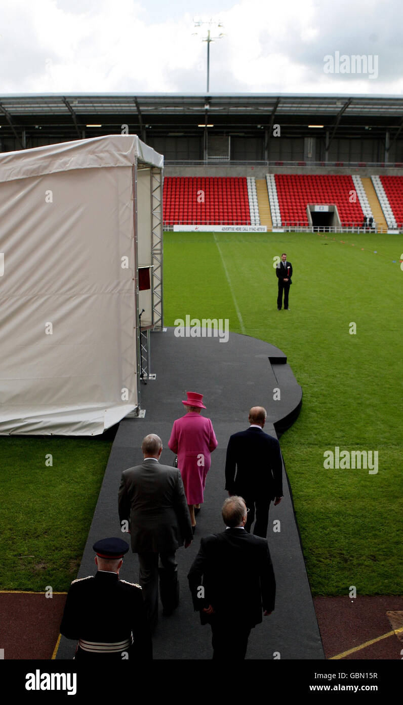 Queen Elizabeth II leads the Royal Party onto the stage at Leigh Sports ...