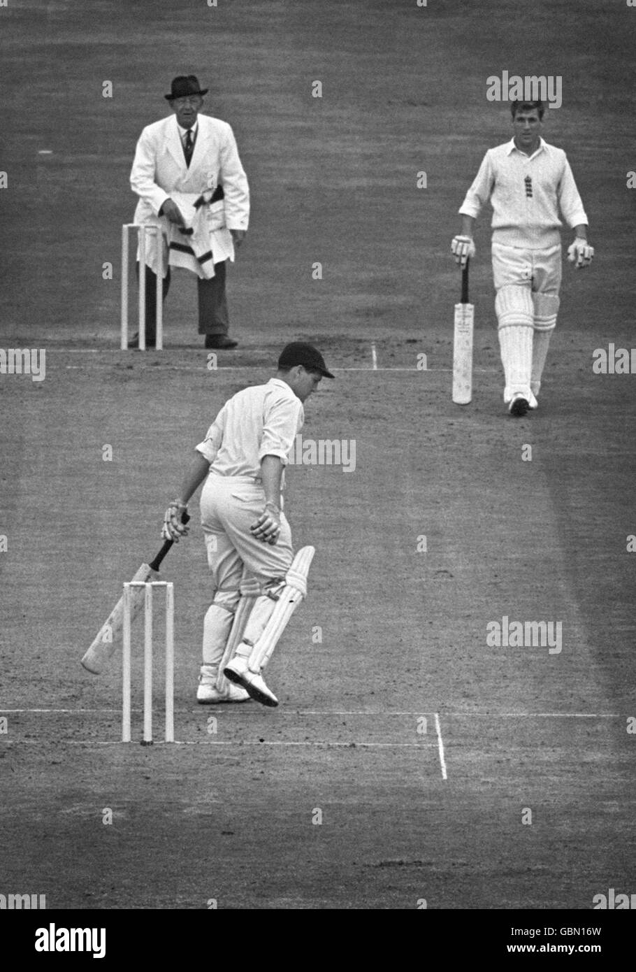 Ken Taylor, bottom left, is caught out by wicket keeper Wally Grout off ...