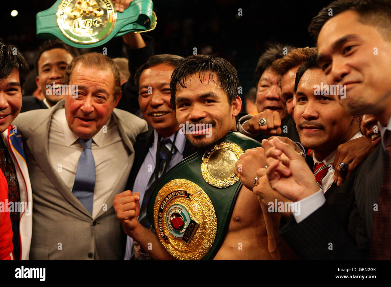 Manny Pacquiao (centre) poses for photographers in the ring after ...