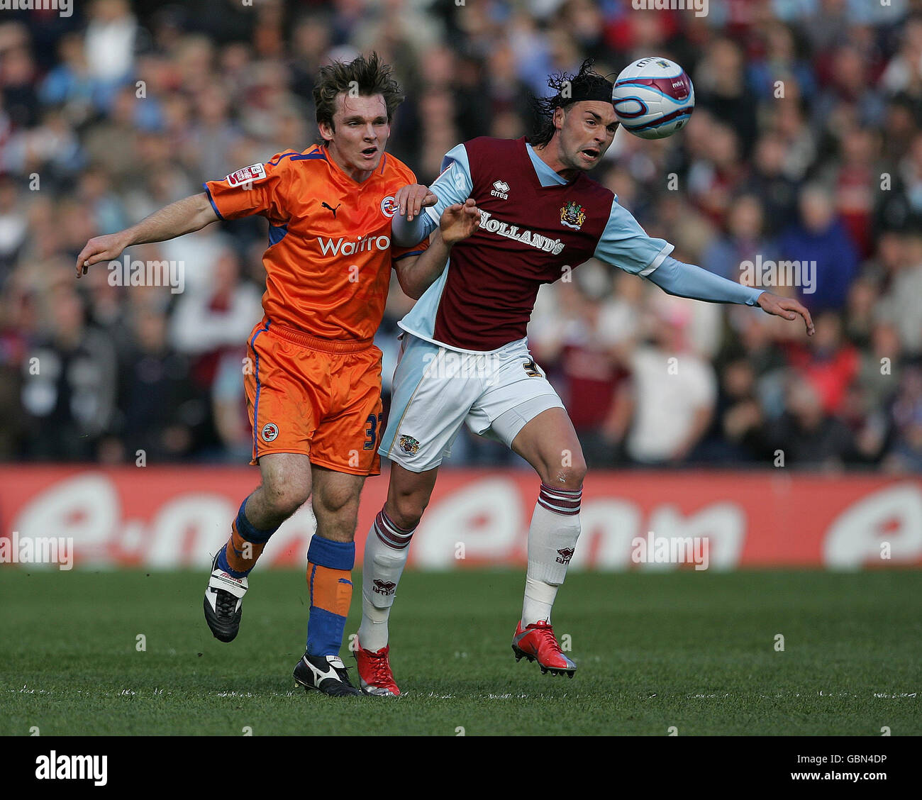Burnley's Chris Eagles and Reading's Jay Tabb in action during the Coca ...
