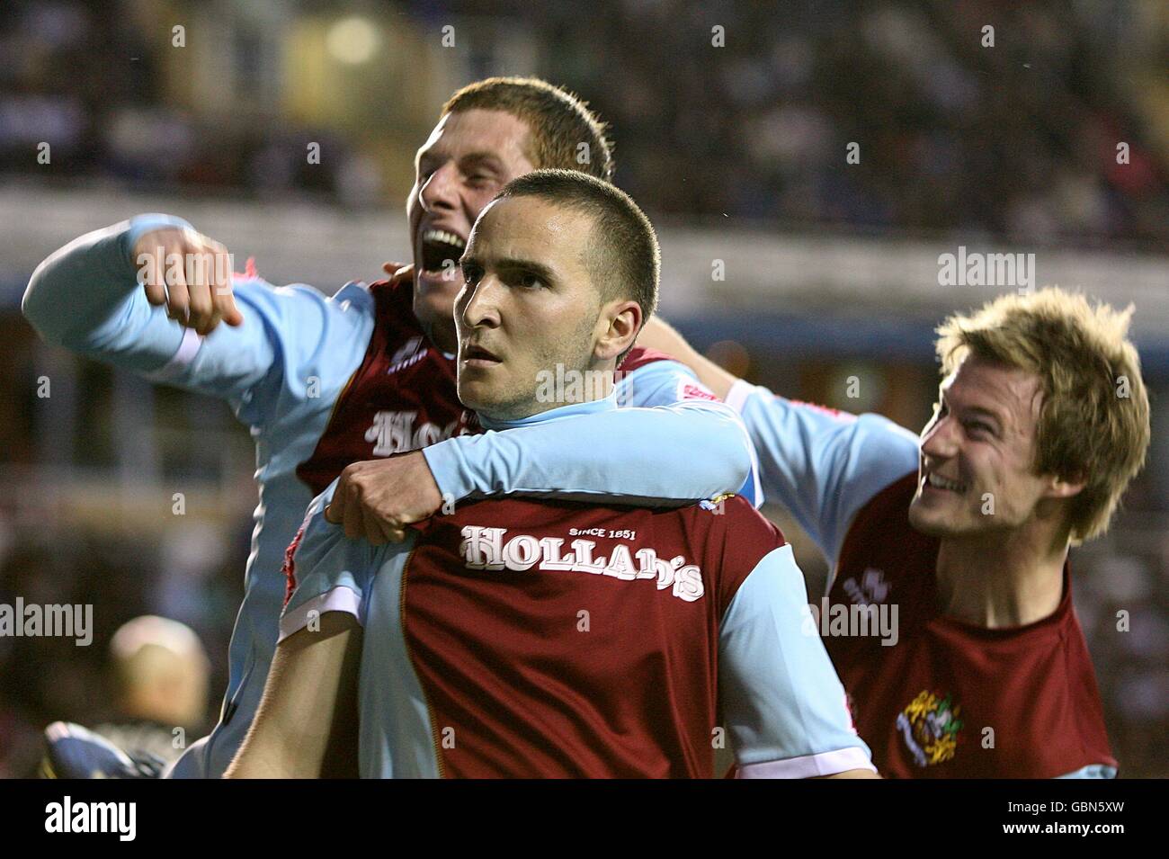 Burnley's Martin Paterson (centre) celebrates with teammates Chris ...