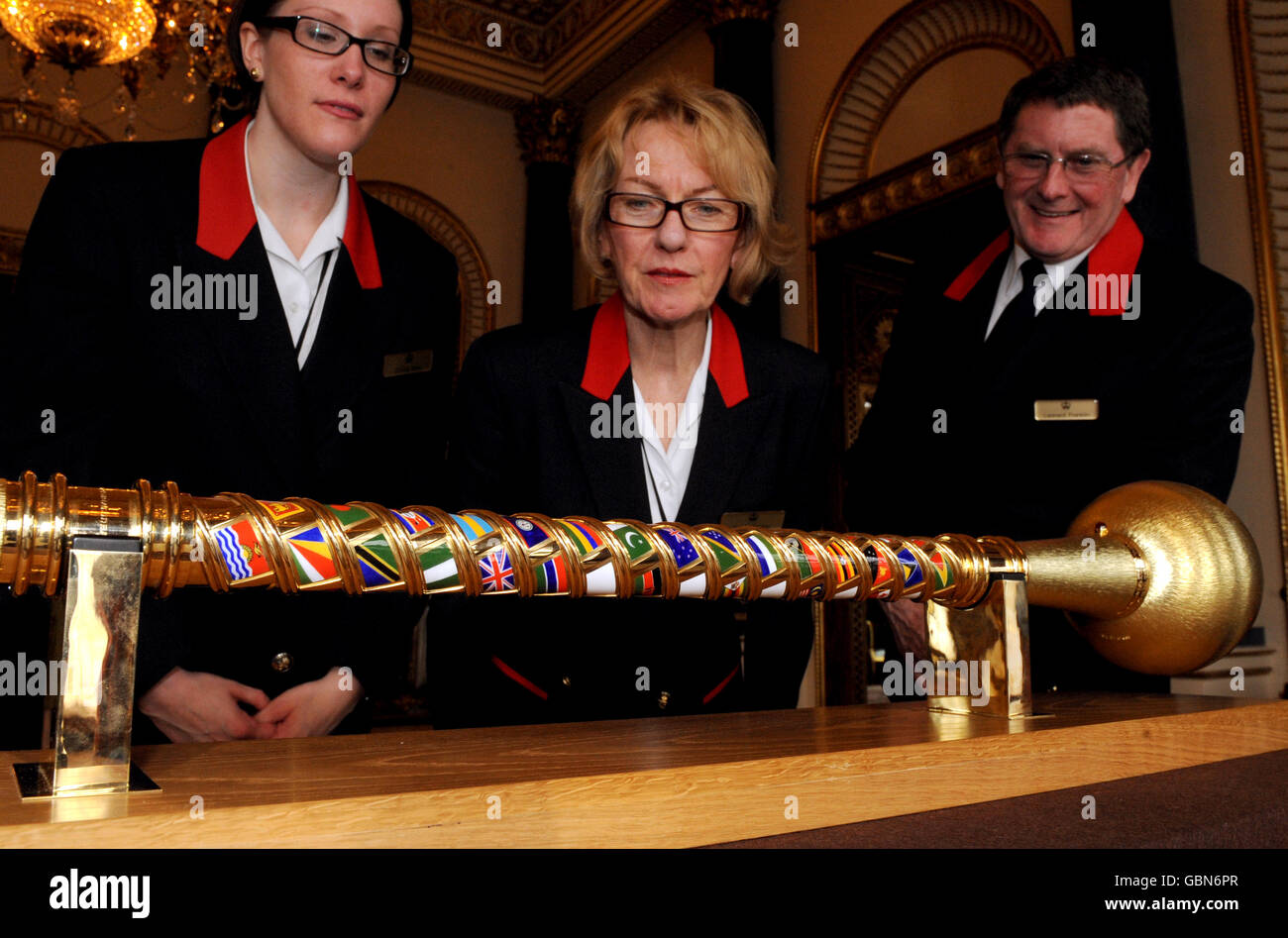 Household staff look at the Commonwealth Mace, displayed inside ...