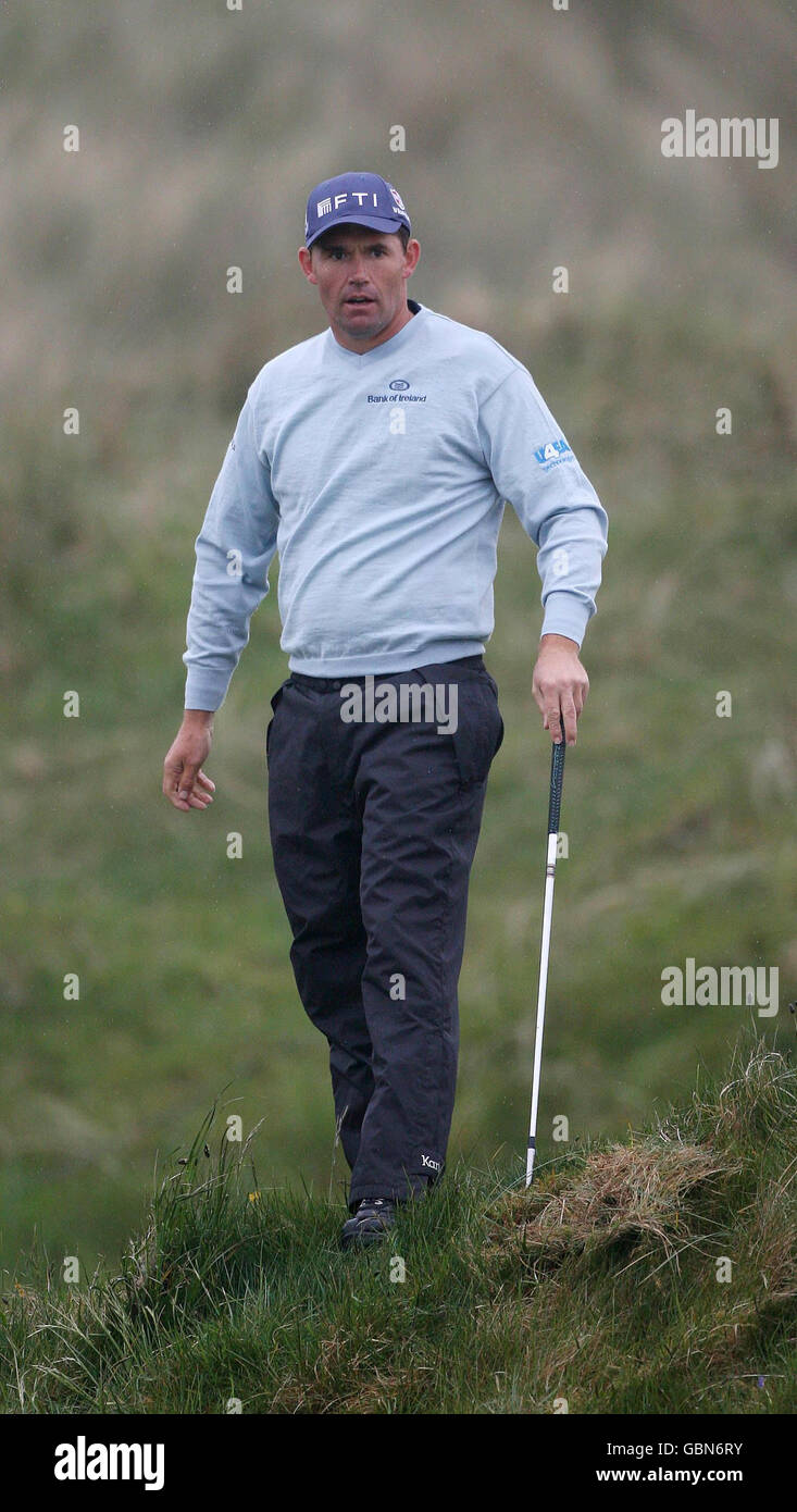Ireland's Padraig Harrington watches his shot out of the heavy rough on ...