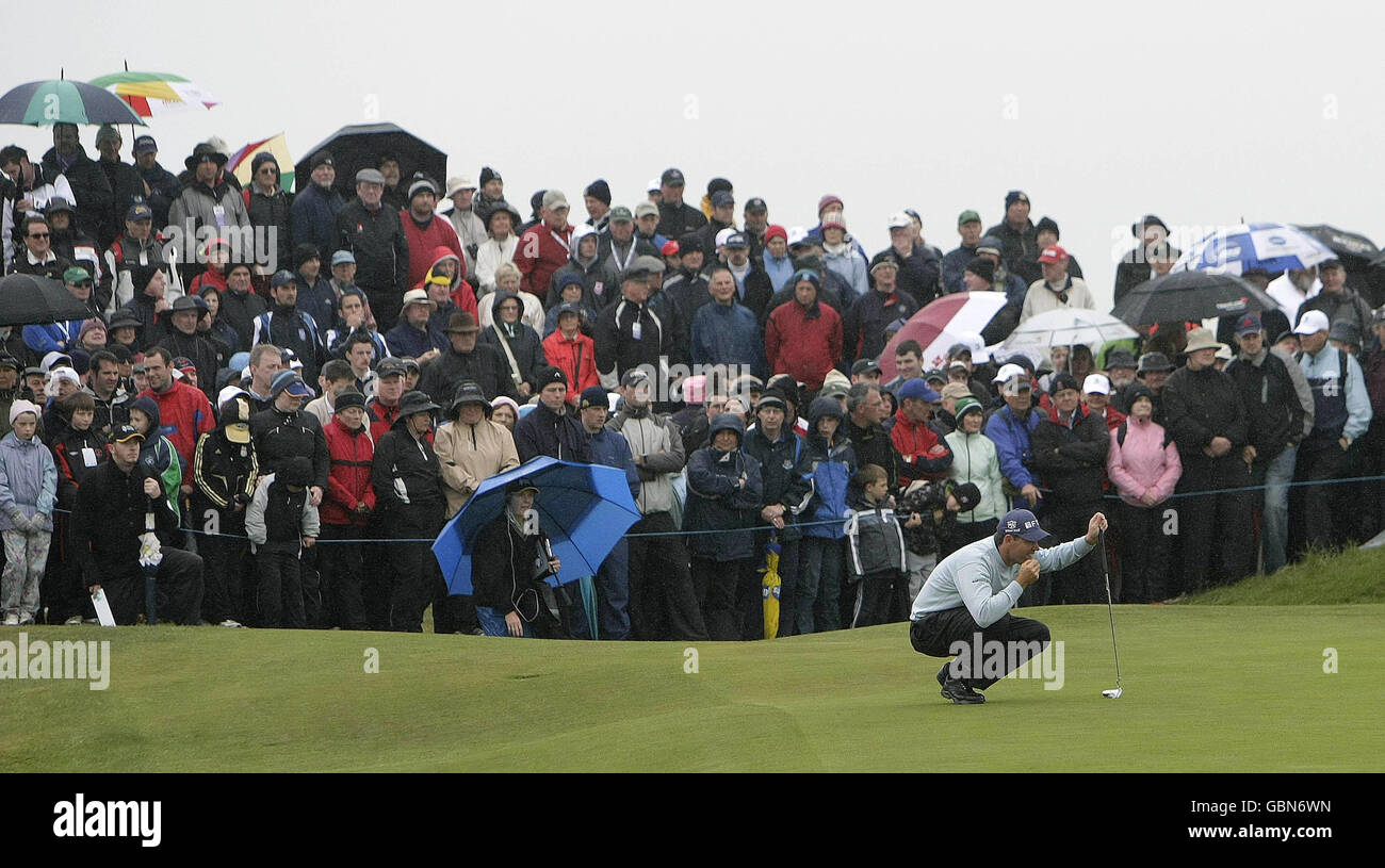 Ireland's Padraig Harrington lines up his shot on the 7th green as a ...