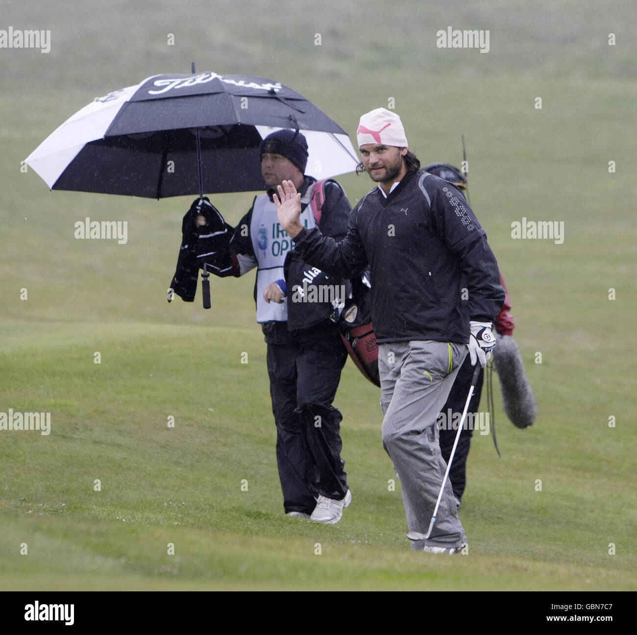 Sweden's Johan Edfors waves to the crowd on the 8th hole during the 3 ...