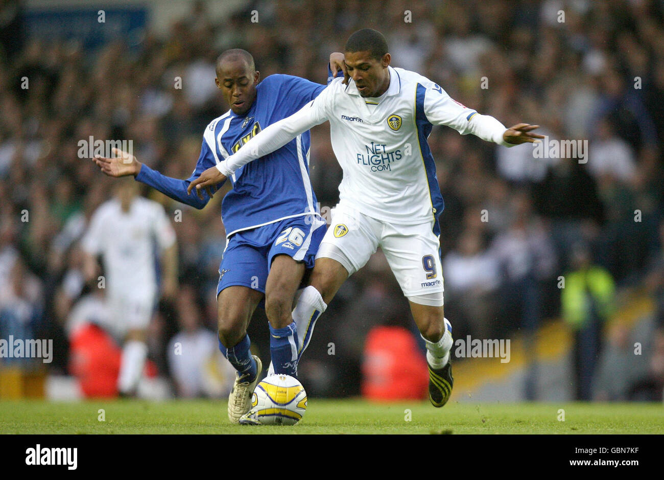 Leeds United's Jermaine Beckford (right) battles for the ball with ...
