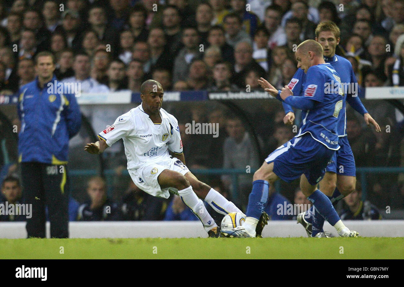 Leeds United's Fabian Delph (centre) challenges Millwall's Alan Dunne ...