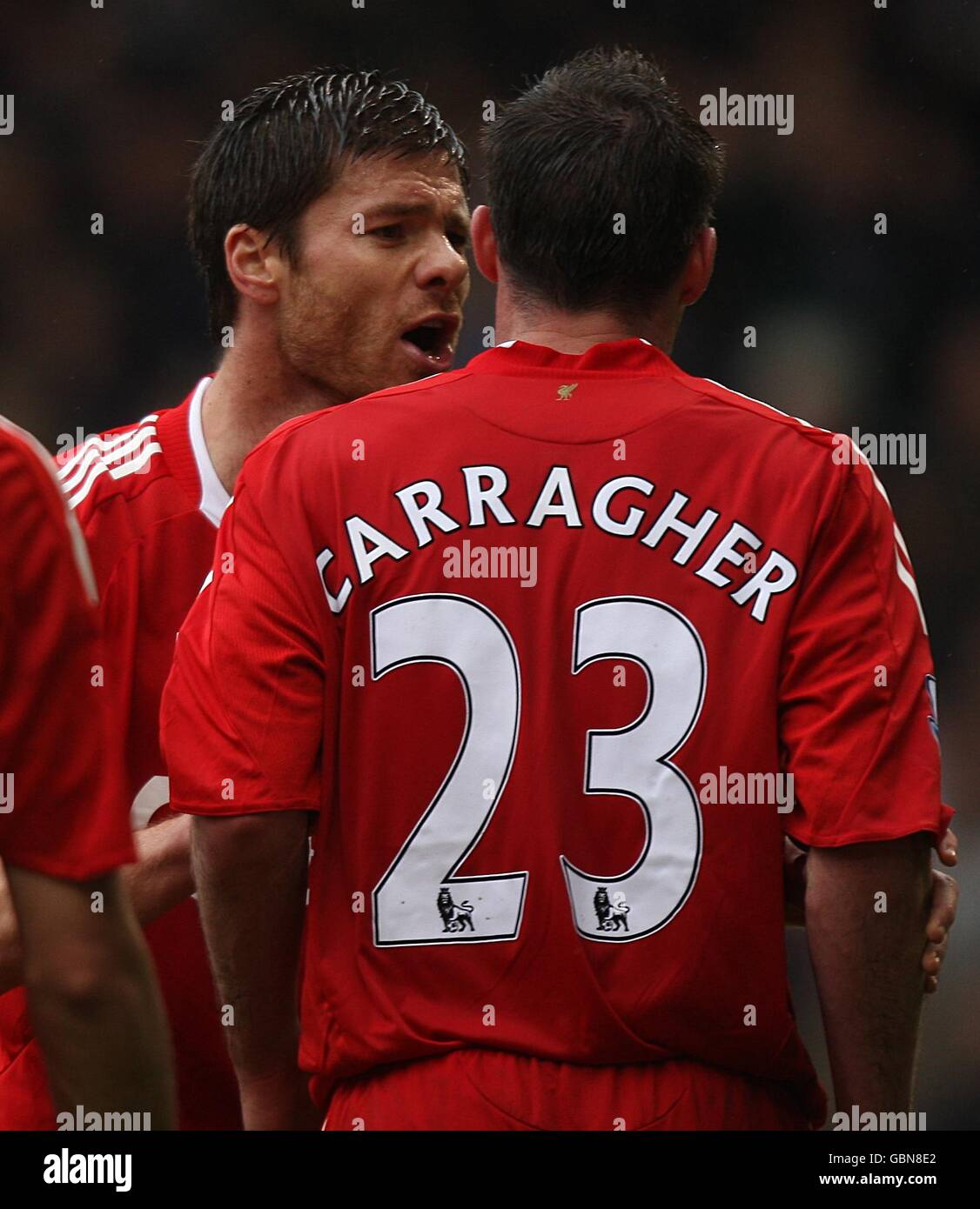 Liverpool's Xabi Alonso (left) acts as peacemaker after an argument ...