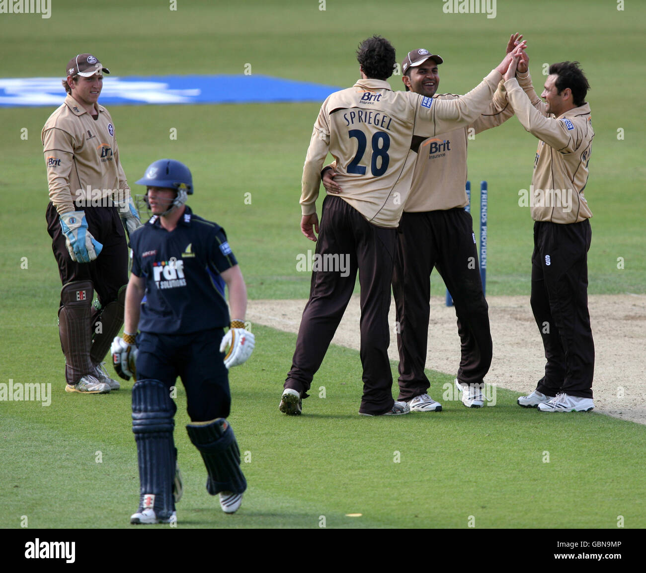 Surrey's Captain Usman Afzaal and Mark Ramprakash celebrate with ...