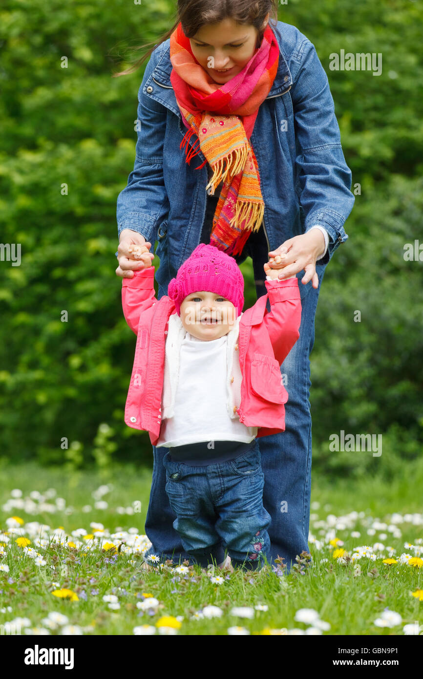 Baby's first steps Stock Photo - Alamy