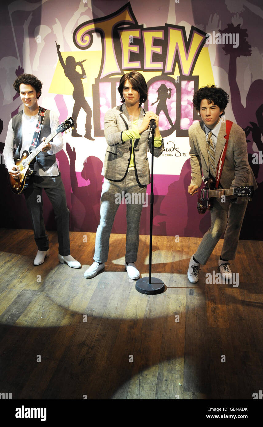 Wax models of the Jonas brothers (left to right) Nick, Joe and Kevin ...