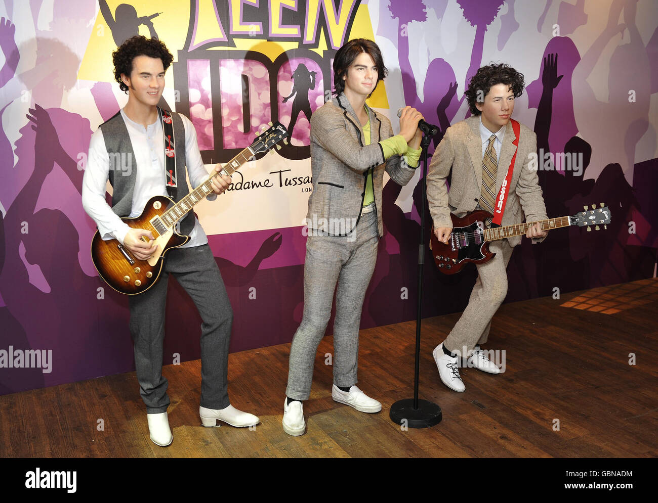 Wax models of the Jonas brothers (left to right) Nick, Joe and Kevin ...