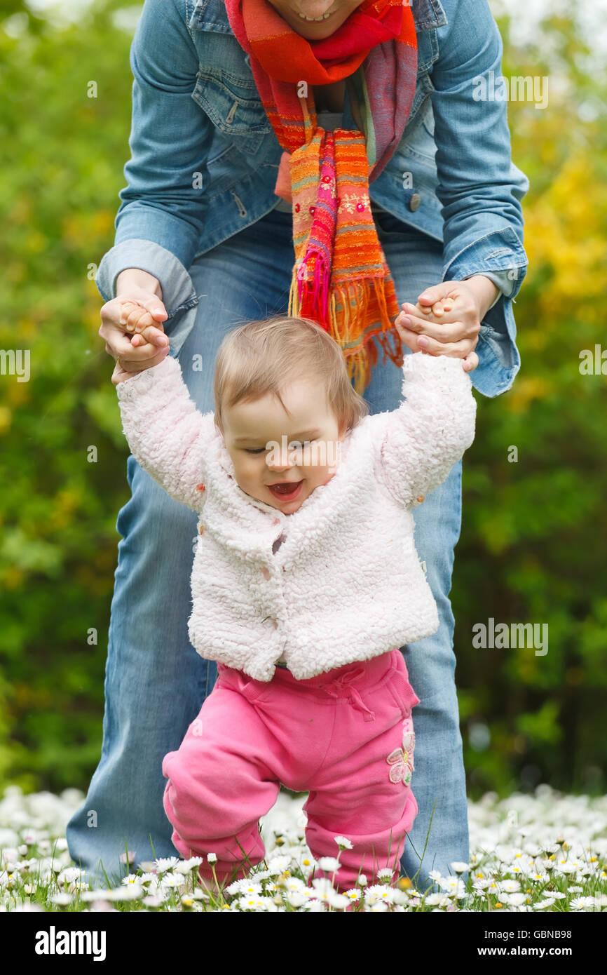 Baby's first steps Stock Photo - Alamy
