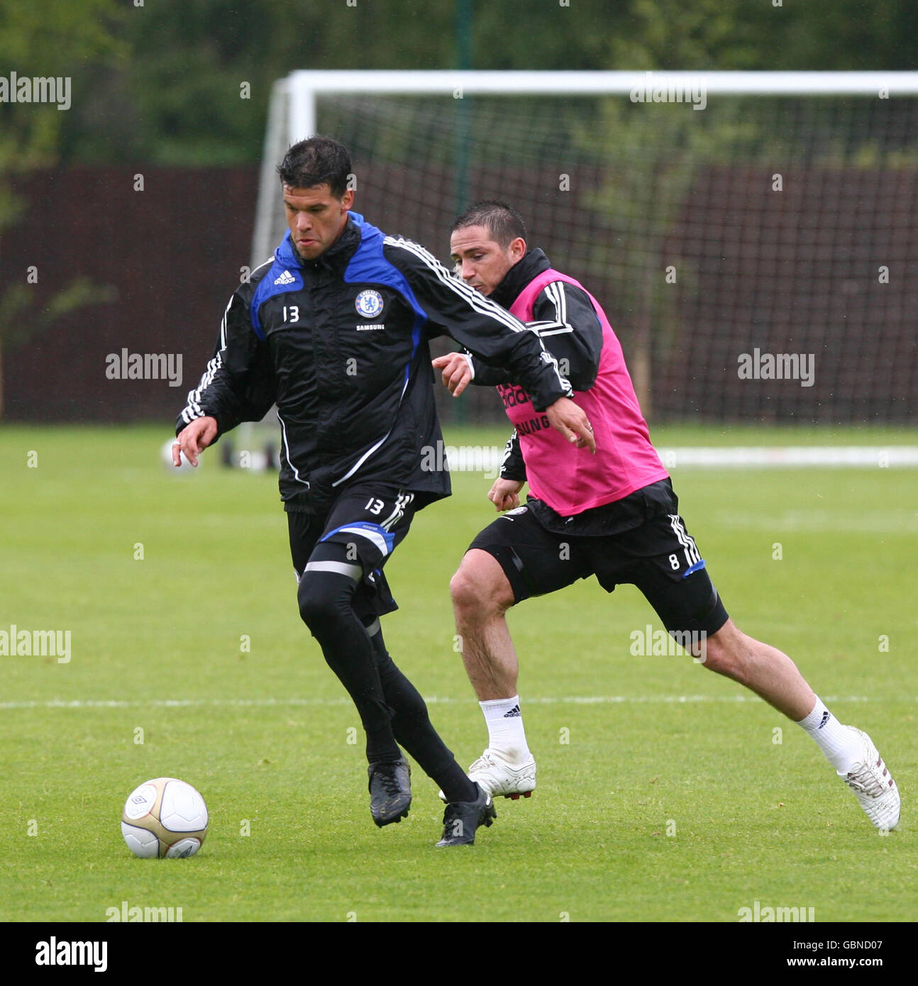 Chelsea's Frank Lampard (right) challenges team-mate Michael Ballack ...