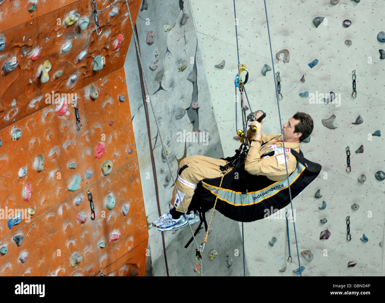 Major Phil Packer of the Royal Military Police climbs the climbing wall ...