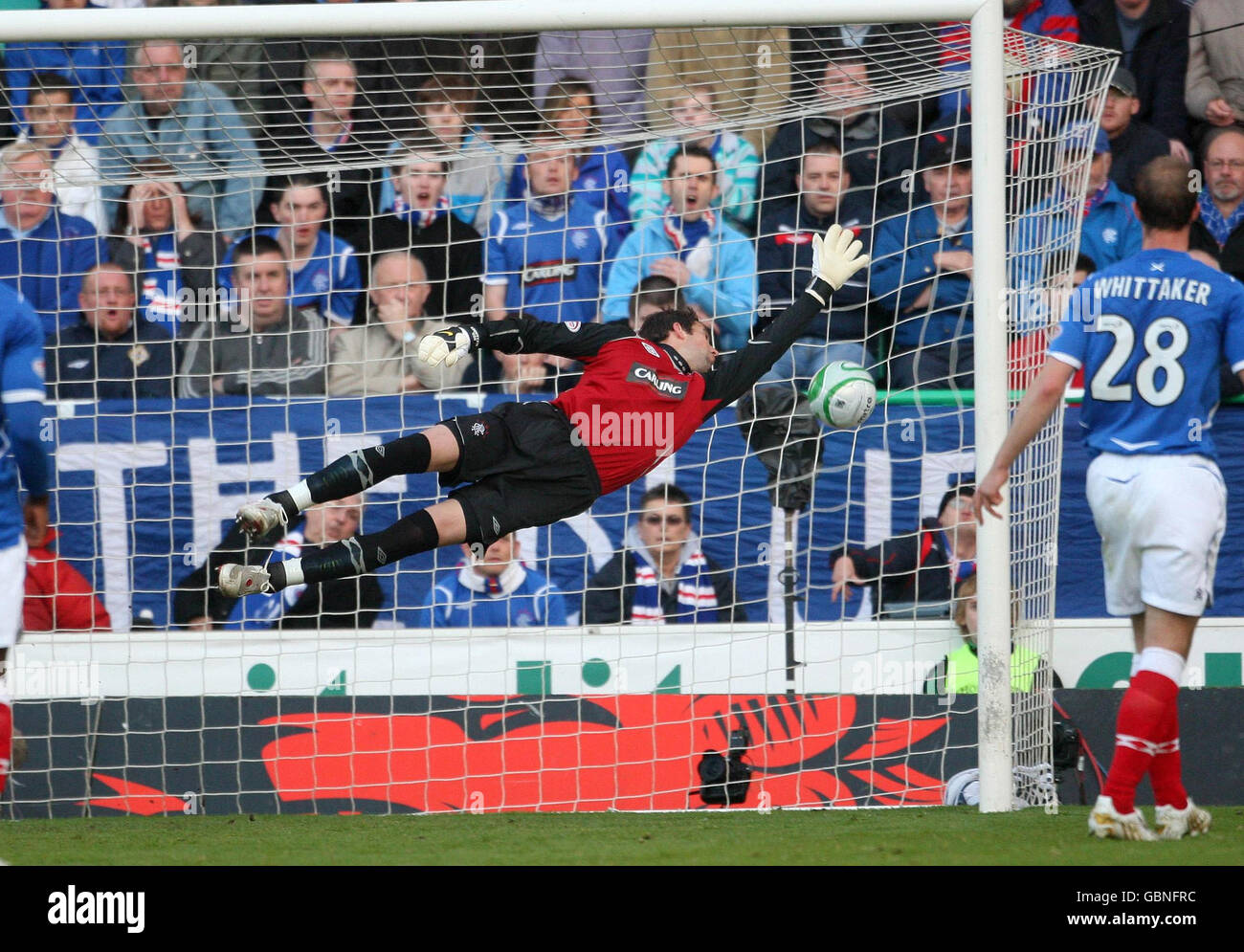 Rangers goalkeeper Neil Alexander is powerless to stop a shot flying in ...
