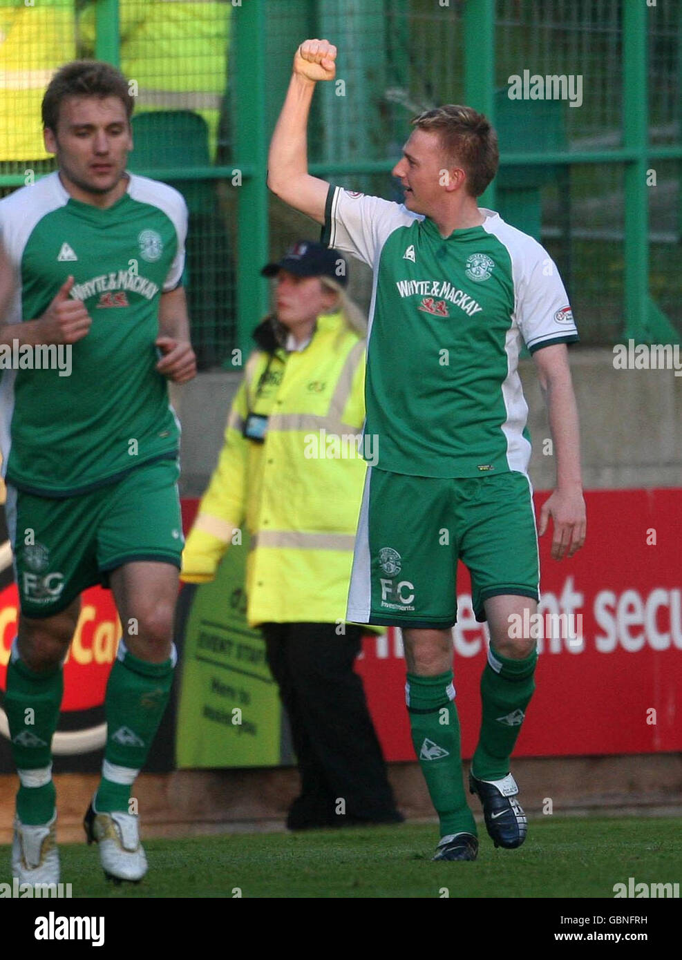 Hibernian's Derek Riordan (right) celebrates scoring their first goal ...