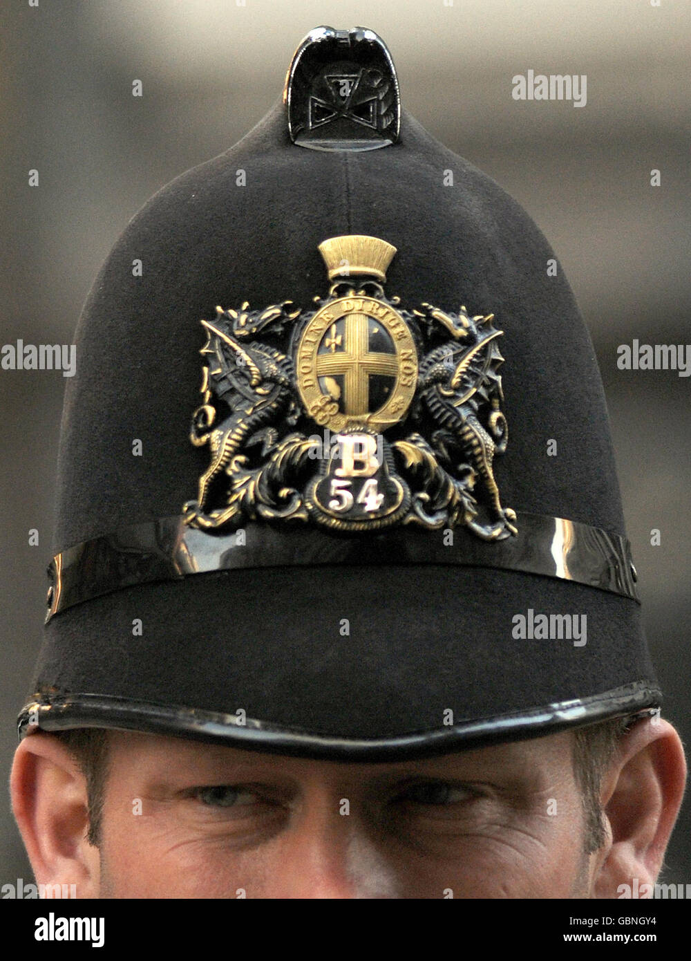 A Metropolitan Police Officers wears a helmet in London Stock Photo - Alamy