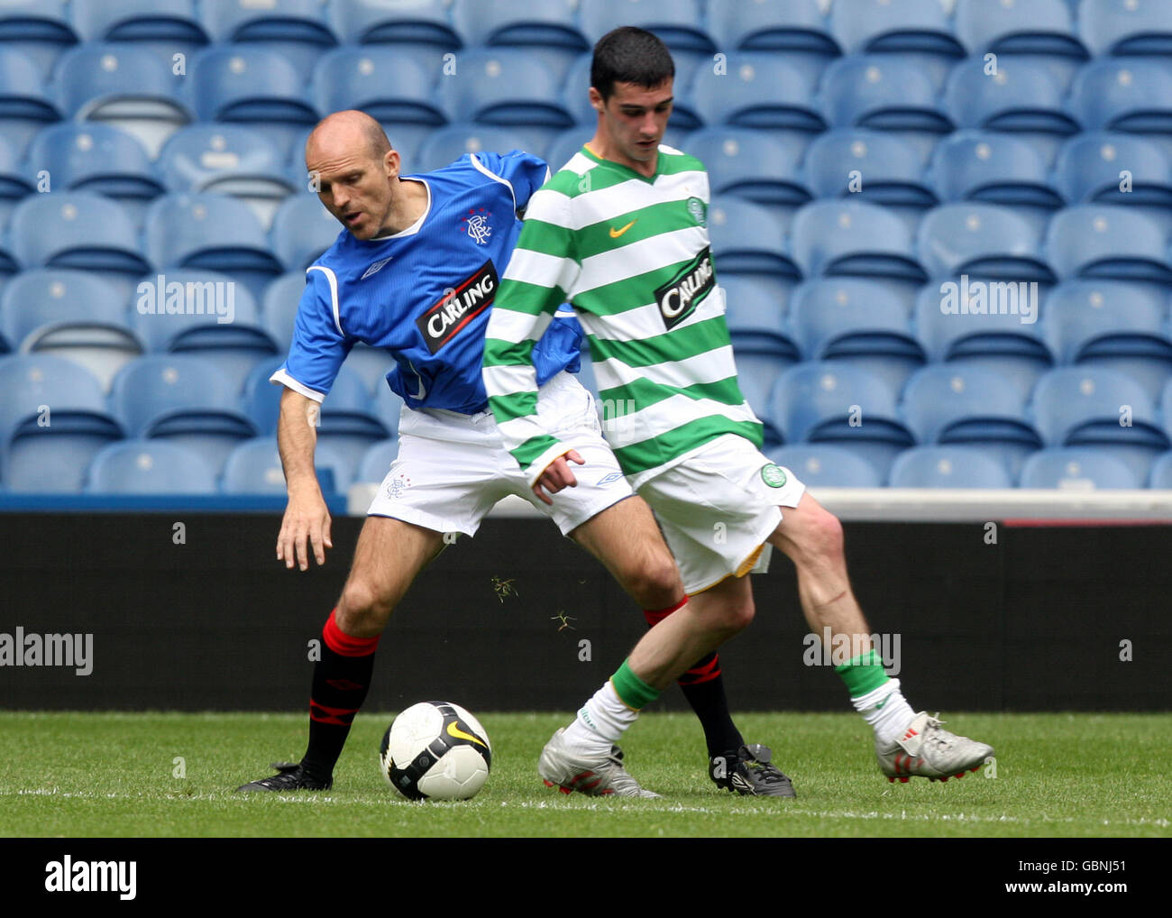 Former Rangers player Alex Rea (left) during a football match at Ibrox ...