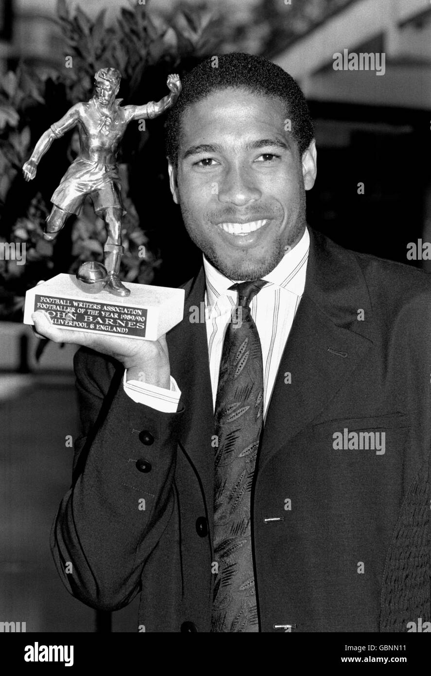 Liverpool's John Barnes shows off the Footballer of the Year trophy ...