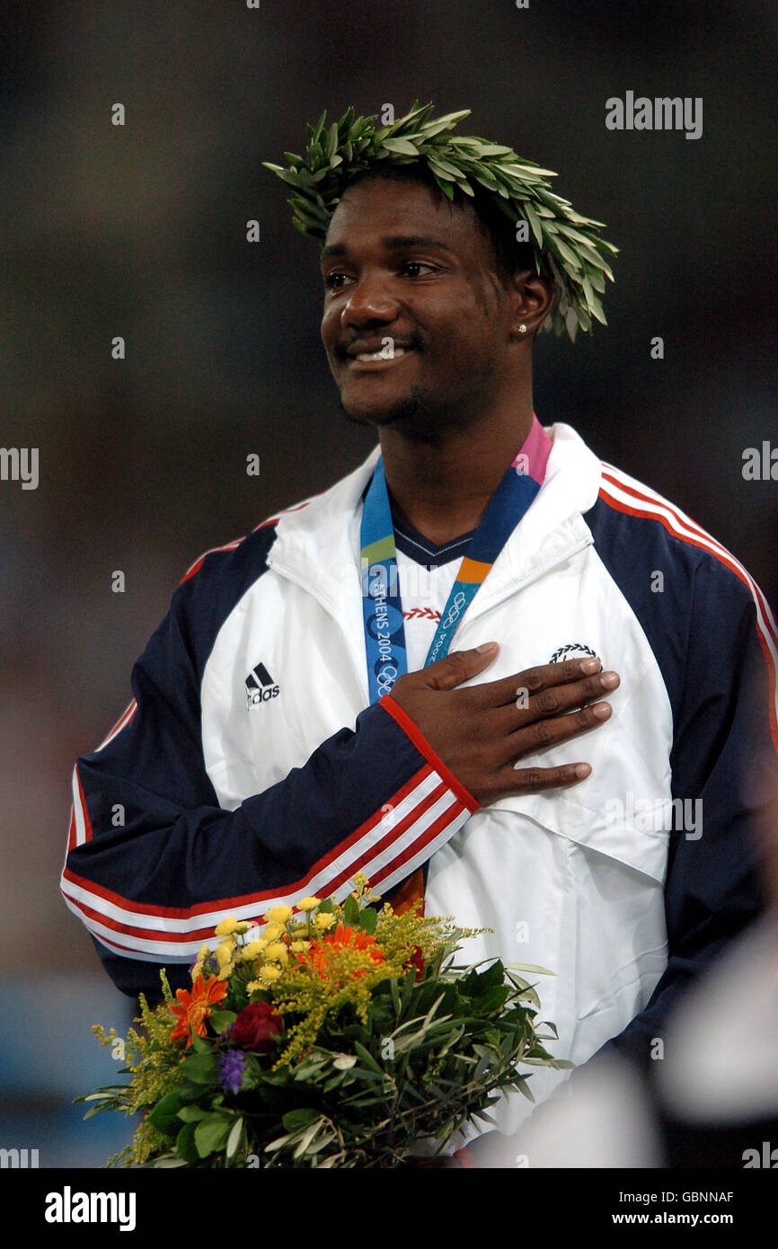 USA's Justin Gatlin during the American national anthem after recieving ...