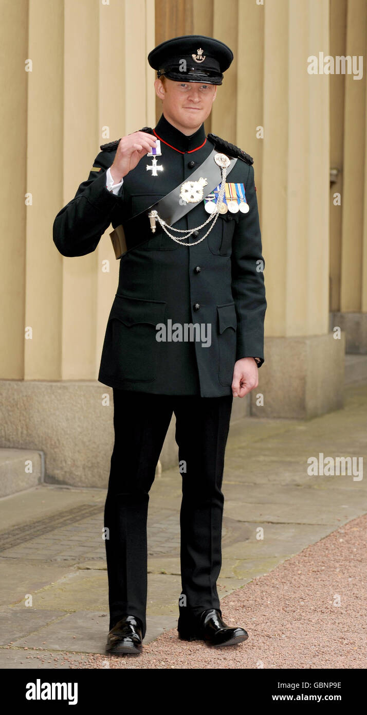 Major Jeremy Crossley poses outside Buckingham Palace after being made ...