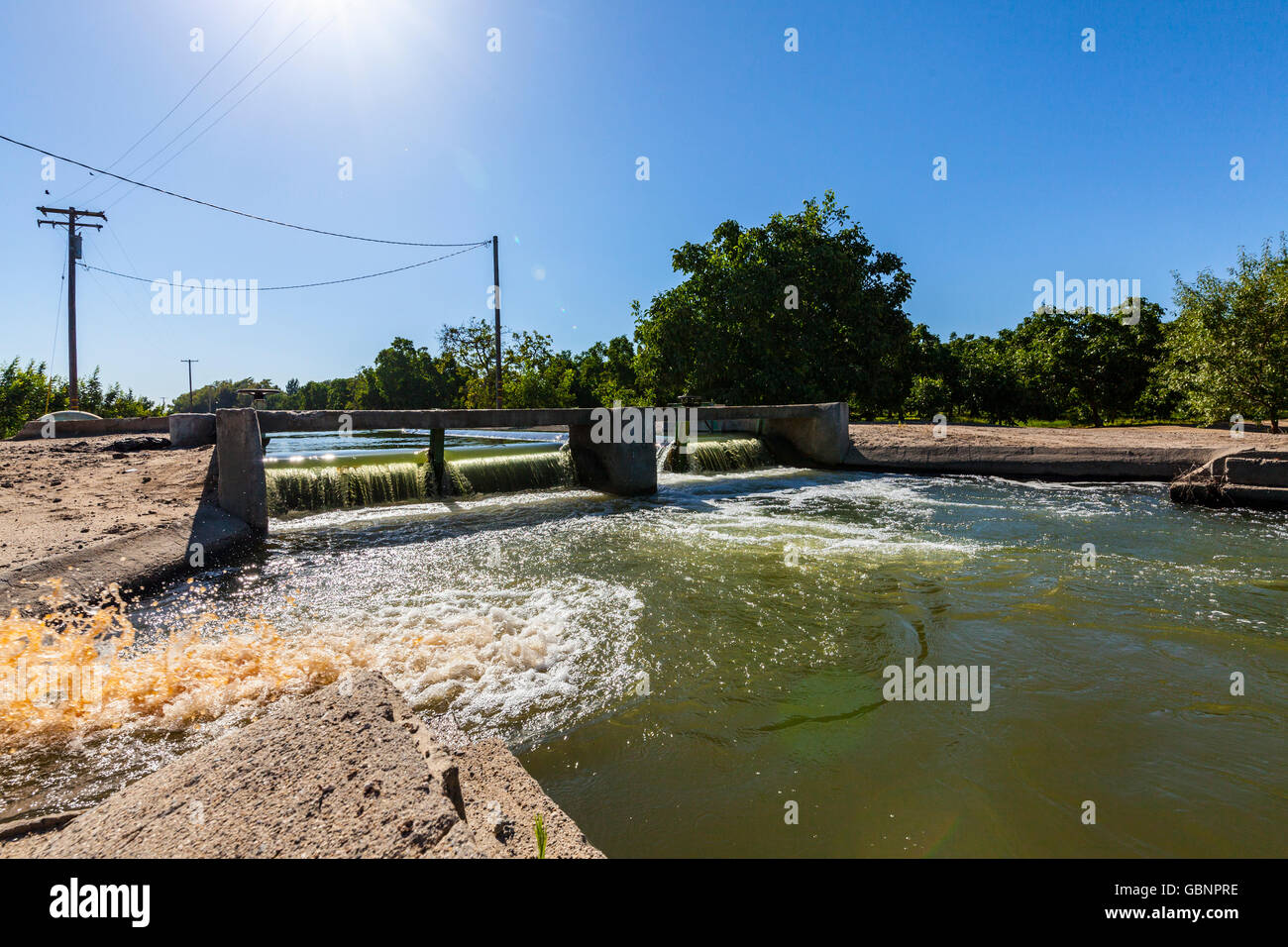 An irrigation canal in the San Joaquin Valley of California near ...