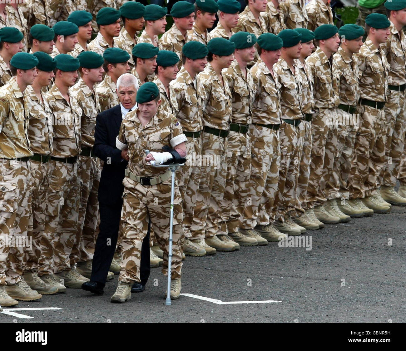 An injured marine from Yankee Company is helped into position, where he ...