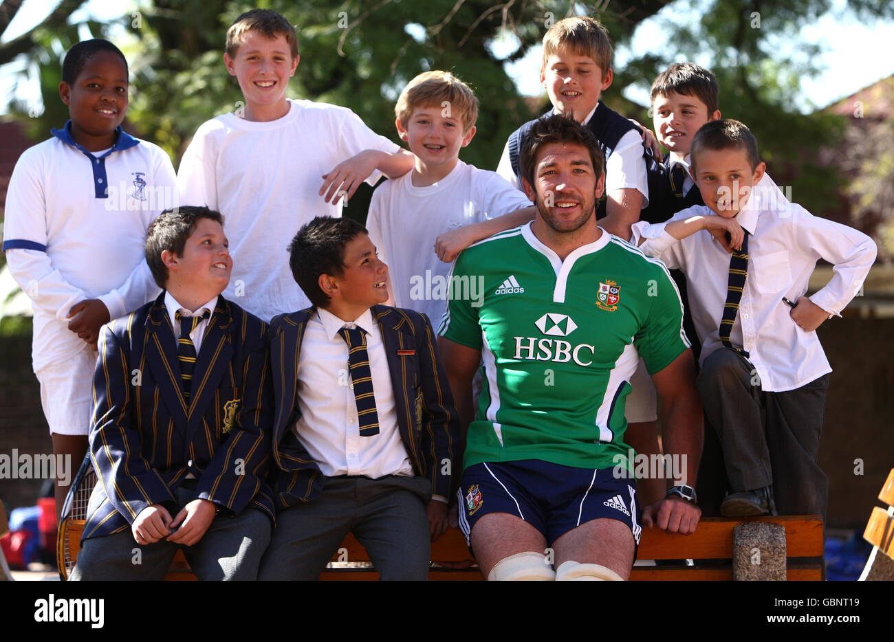 British & Irish Lions Nathan Hines poses for a picture with school boys ...