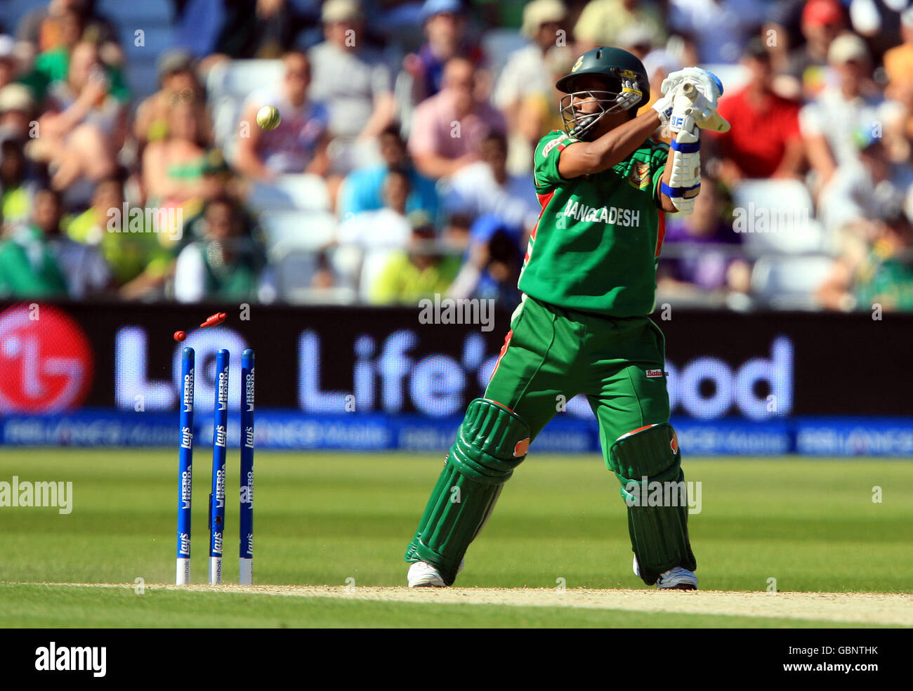 Bangladeshs rogibul hasan is clean bowled by australias brett lee hi ...