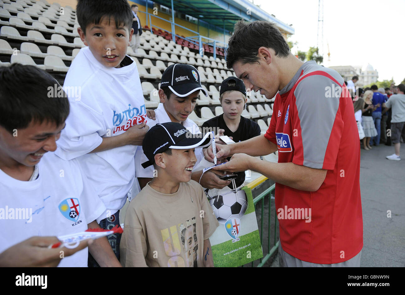 England's Gareth Barry signs merchandise for fans at The ...