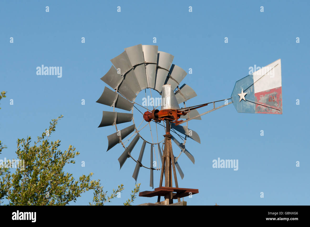 Windmill with Texas flag painted on wind vane Stock Photo - Alamy