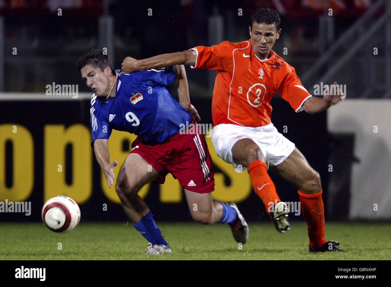 Holland's Khalid Boulahrouz (r) and Liechtenstein's Thomas Beck battle ...