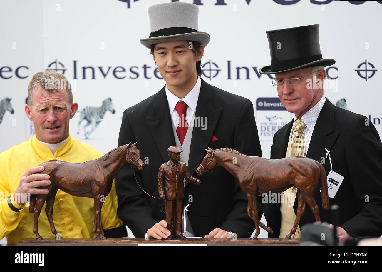Jockey Mick Kinane (left) owner Mr Christopher Tsui (centre) and ...