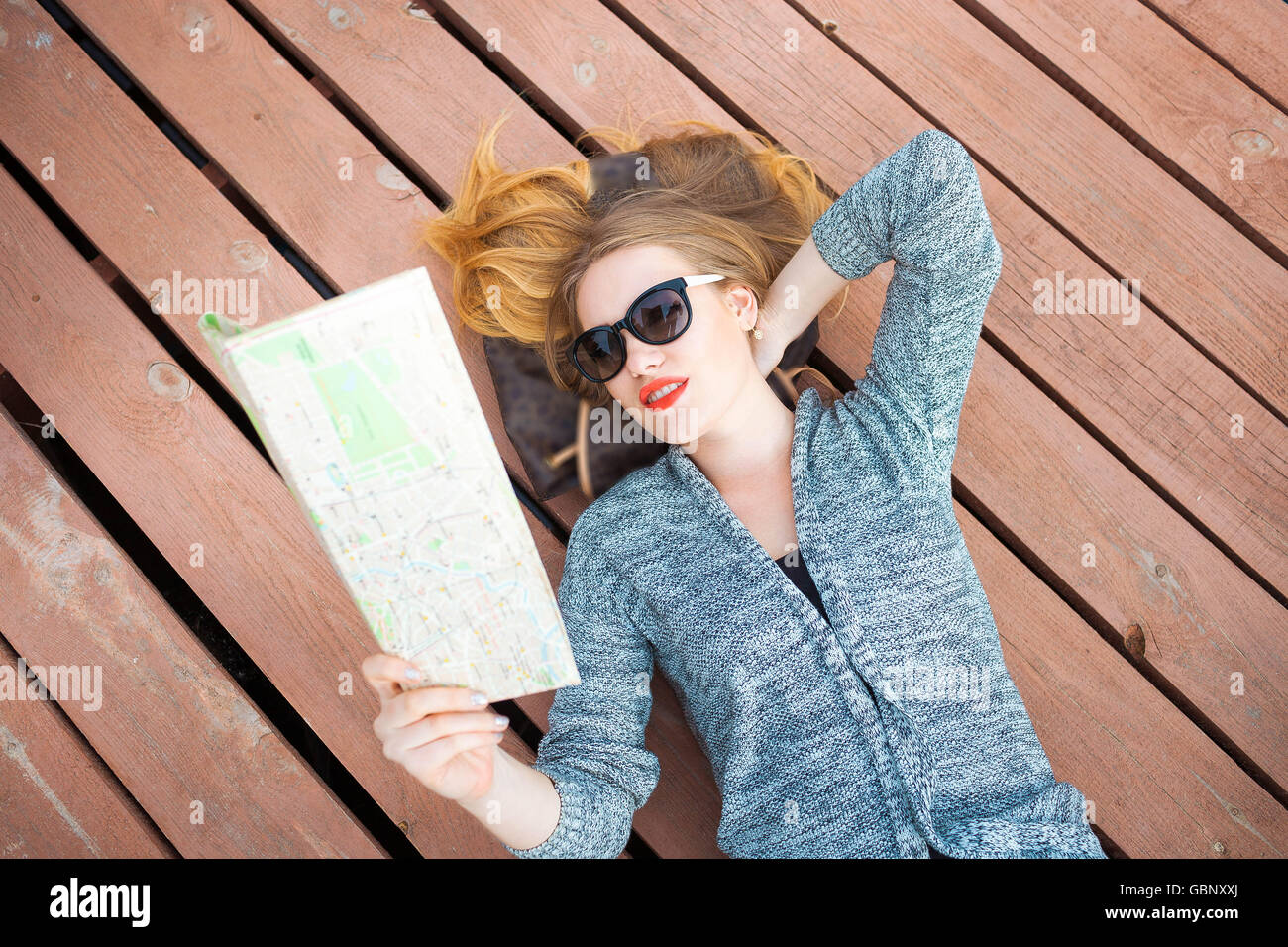 Young woman with map Stock Photo - Alamy