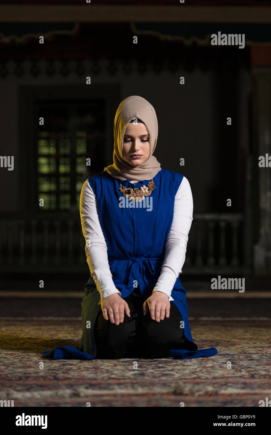 Humble Muslim Woman Is Praying In The Mosque Stock Photo - Alamy