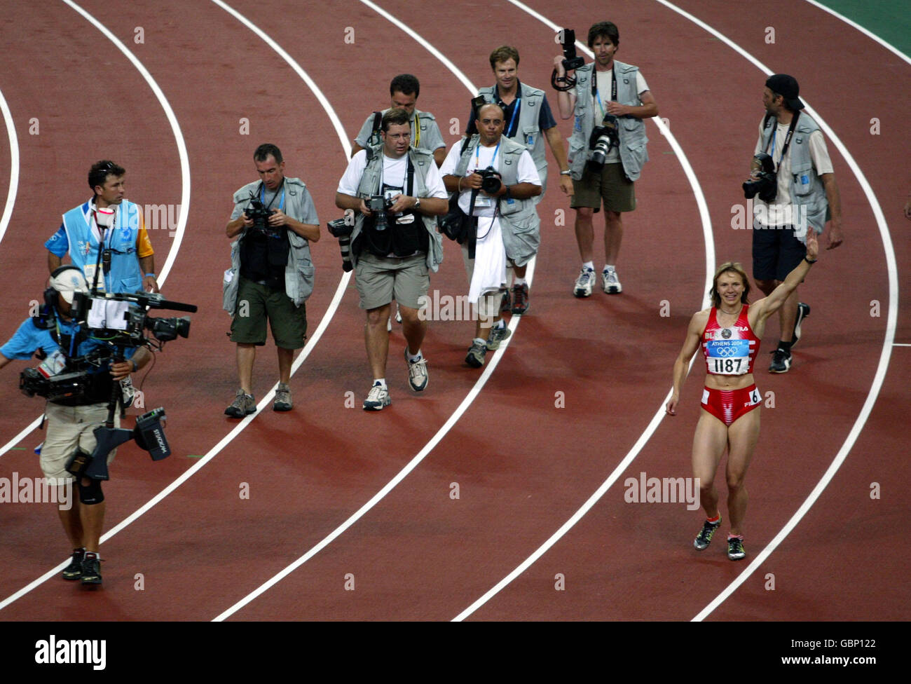 Yuliya Nesterenko from Belarus waves to the crowd after winning the ...