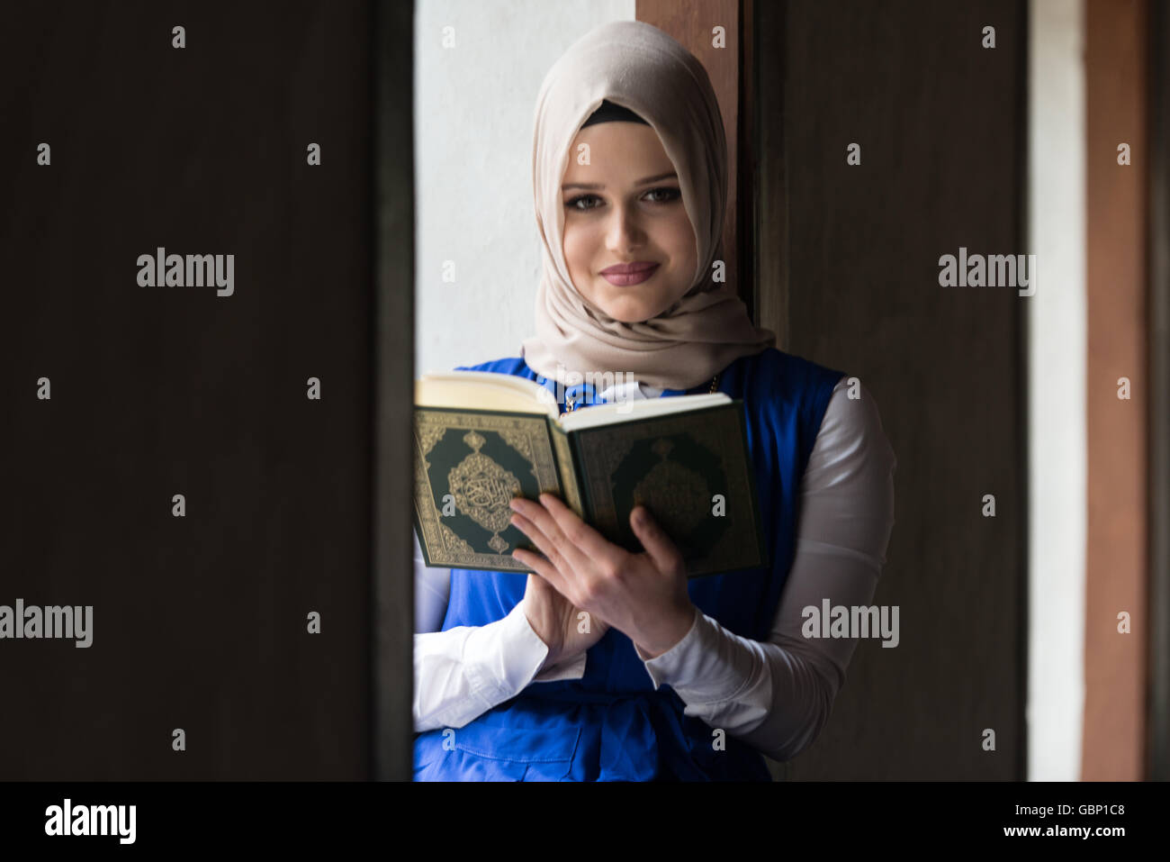 Humble Muslim Woman Is Reading The Koran In The Mosque Stock Photo - Alamy