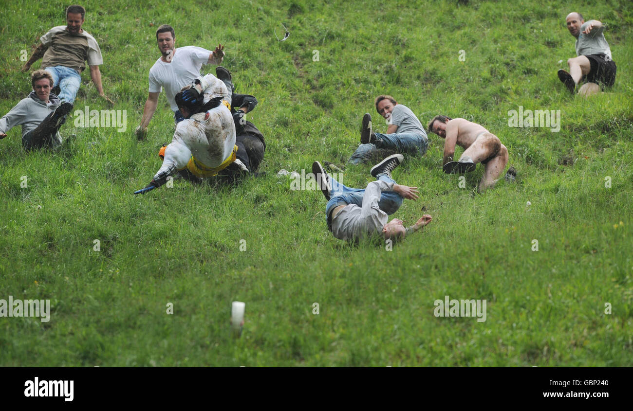 Cheese races away from competitors in one of the annual cheese rolling ...