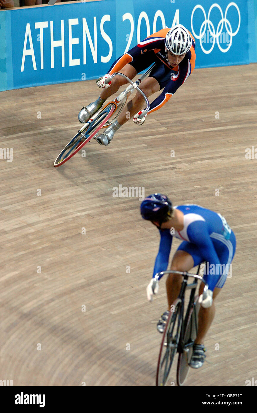 Great Britain's Ross Edgar checks on the position of his opponent the ...