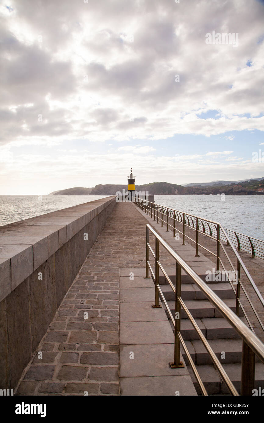 lighthouse at the end of the harbour wall in Comillas Cantabria ...