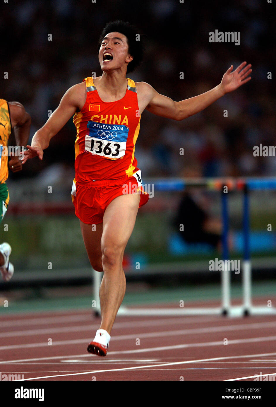 China's Xiang Liu crosses the line to break the olympic record and win ...