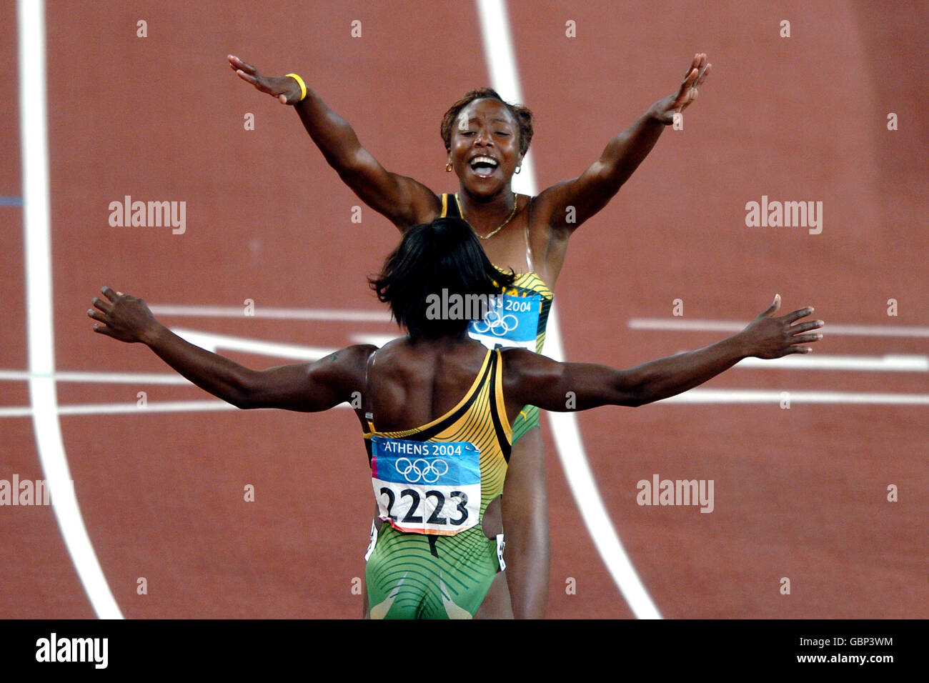 Jamacia's Veronica Campbell and Sherone Simpson run towards eachother ...